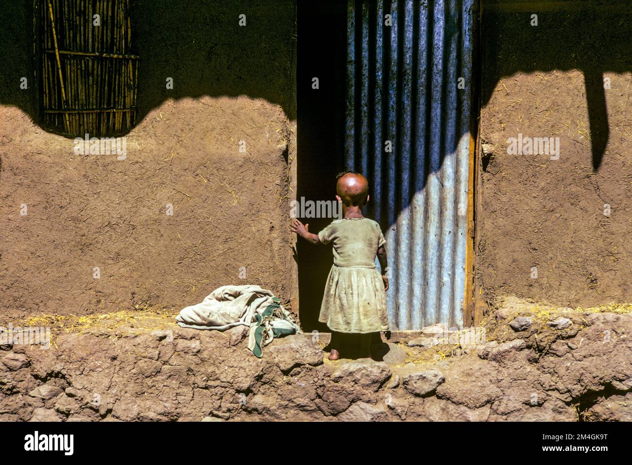 Ethiopia, 1970s, Falasha Jewish village, rear view of little girl ...