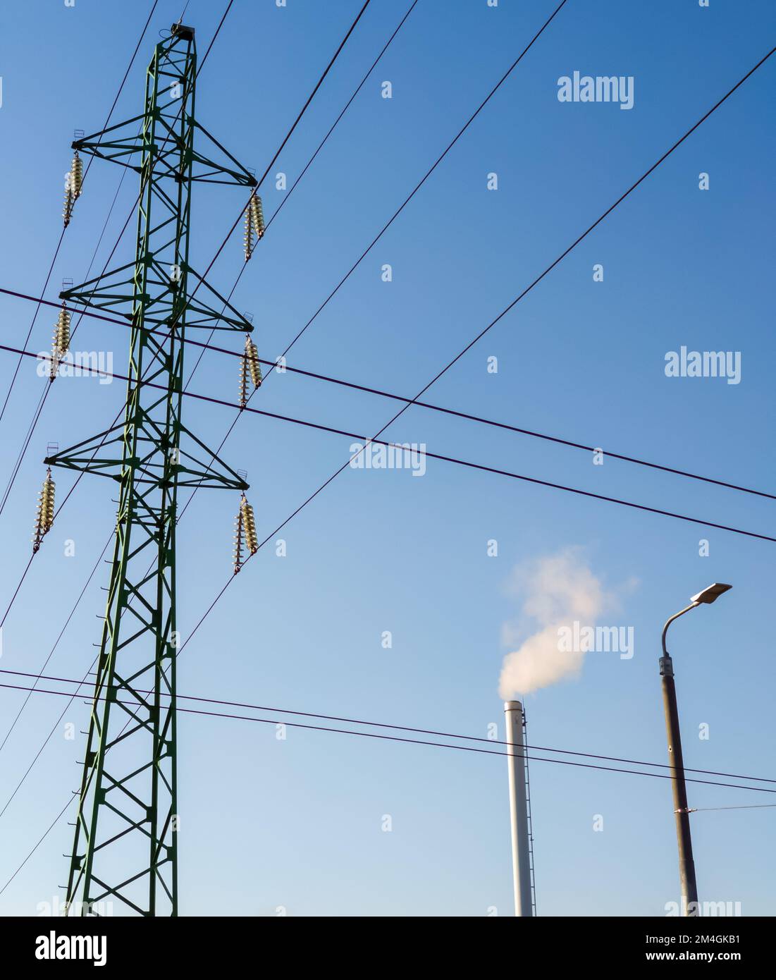 Factory chimney with smoke. Industrial pipe. Power line tower Stock ...