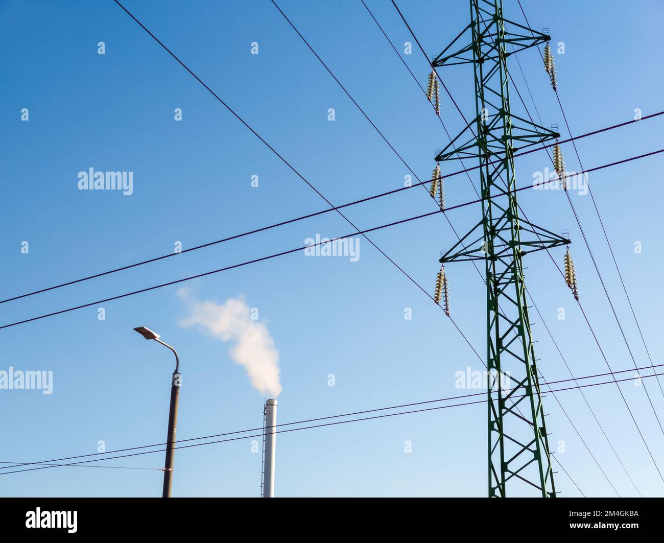 Factory chimney with smoke. Industrial pipe. Power line tower Stock ...