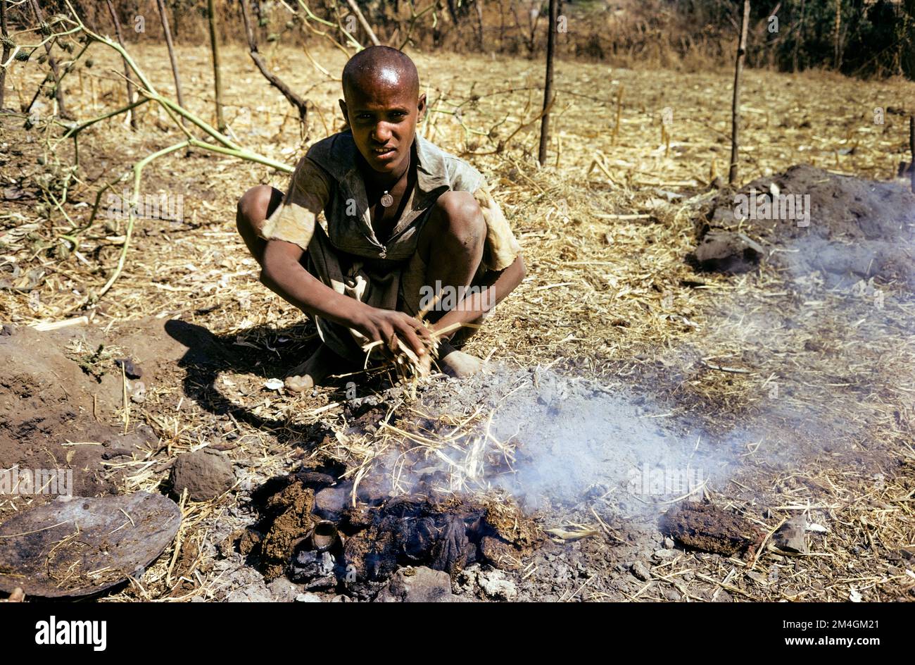 Ethiopia, 1970s, Falasha Jewish village, young man baking clay ...