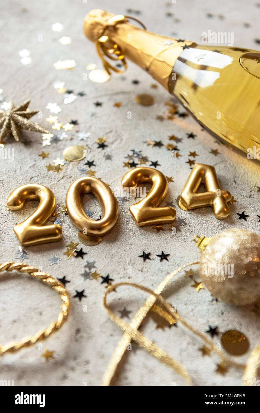 Vertical Golden color palette photo with new year 2024 numbers ...