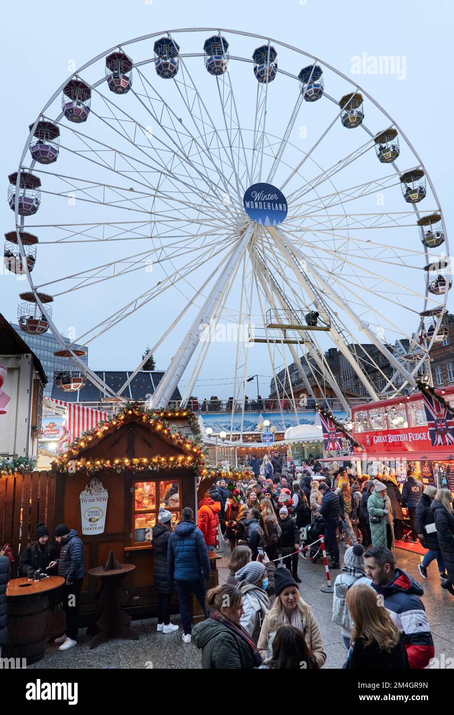 Winter Wonderland ferris wheel above Christmas market stalls in Old ...