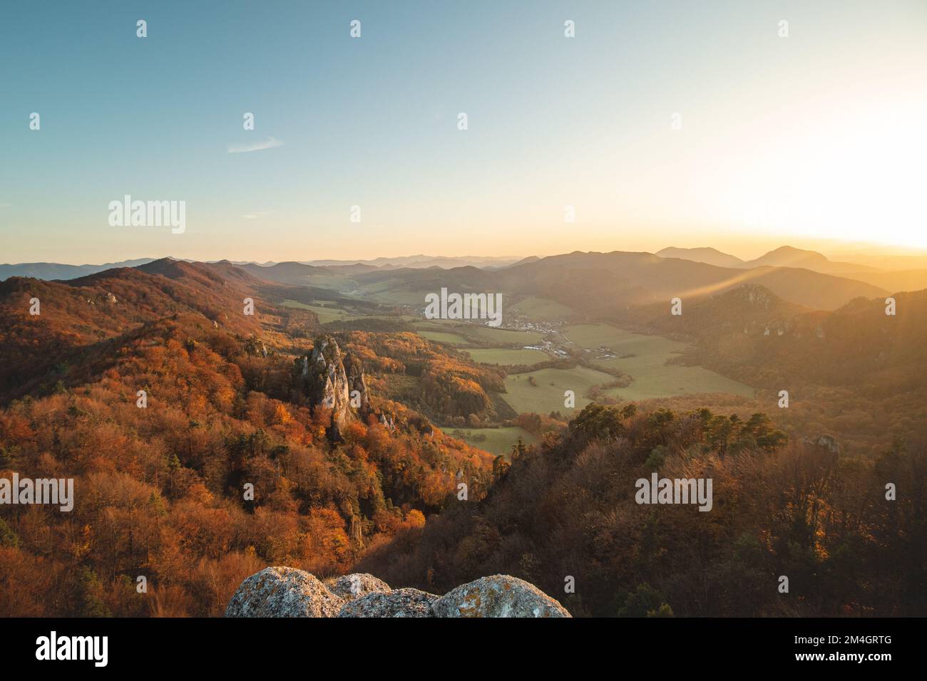 Sunset over autumn colourful forests surrounding Sulovske rocks in ...