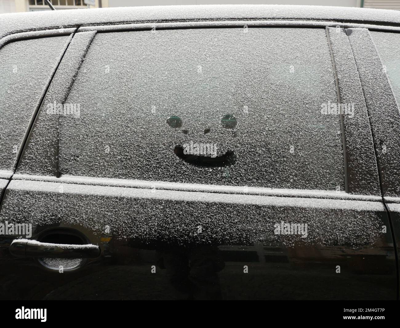 smiley in snow on car window Stock Photo - Alamy