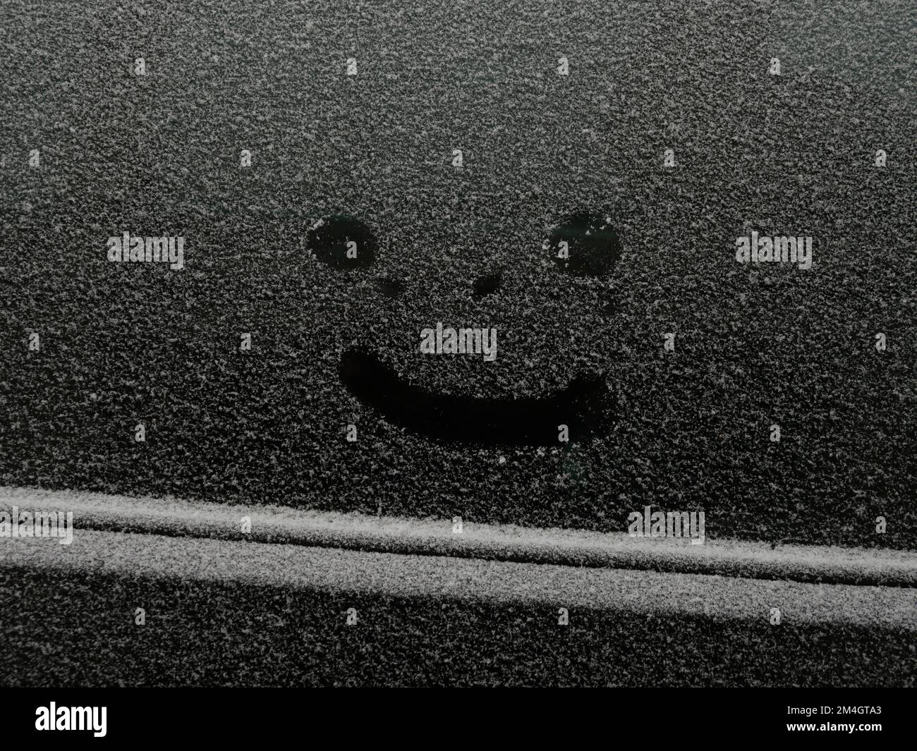 smiley in snow on car window Stock Photo - Alamy