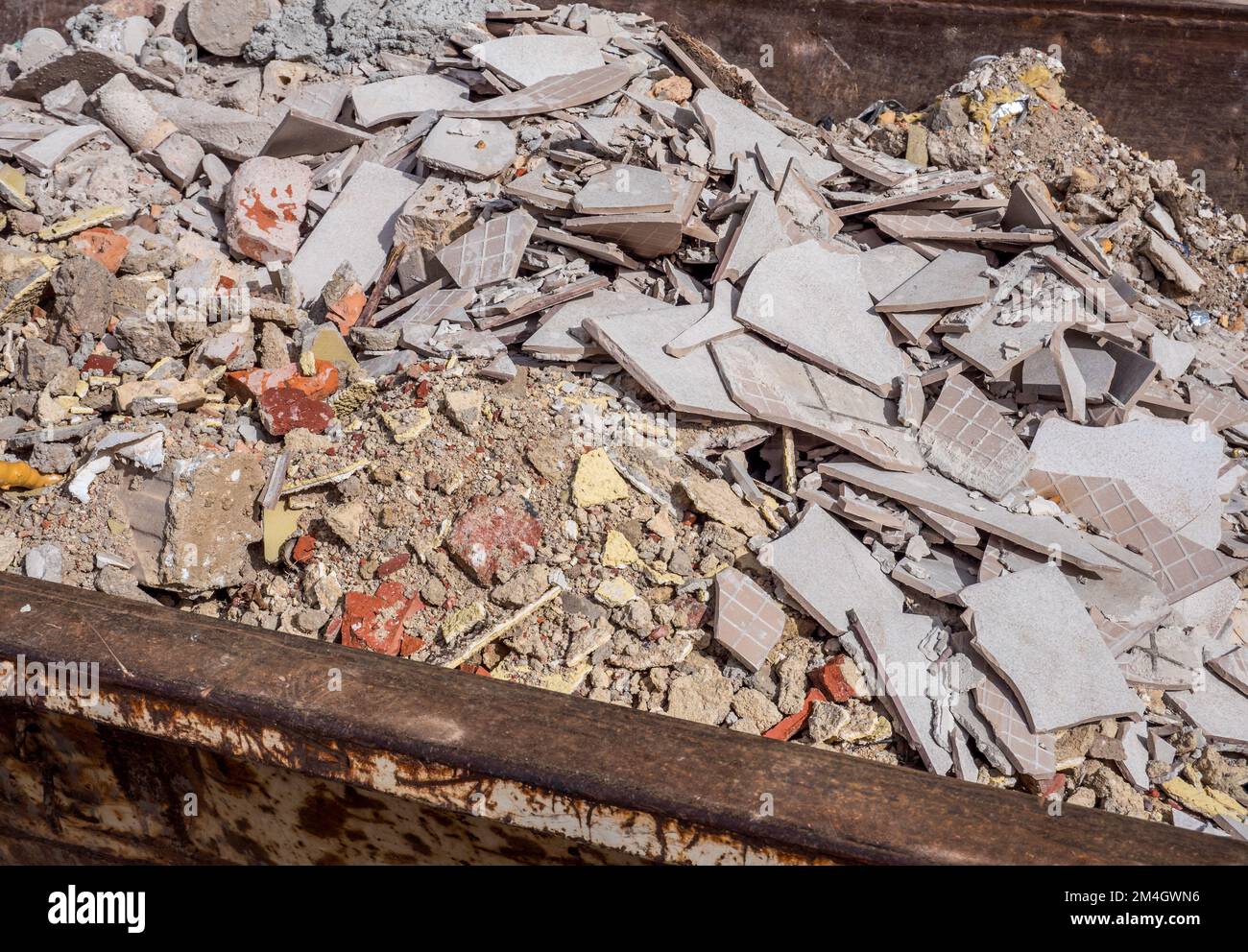 Construction waste in a container Stock Photo - Alamy