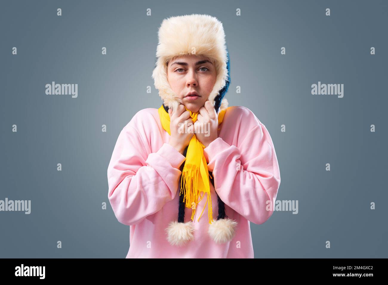 Illness and flu. Portrait of young cold woman in hat and scarf is ...