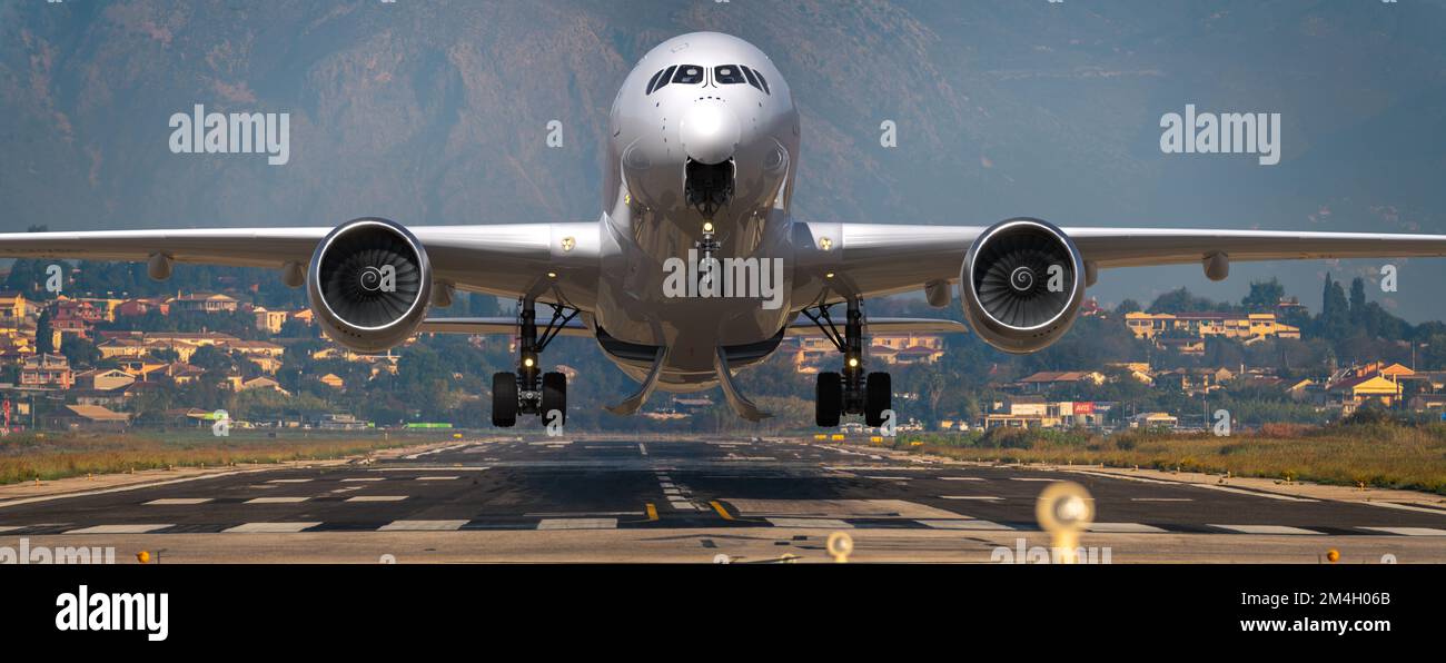 Passenger plane taking off from the airport Stock Photo - Alamy