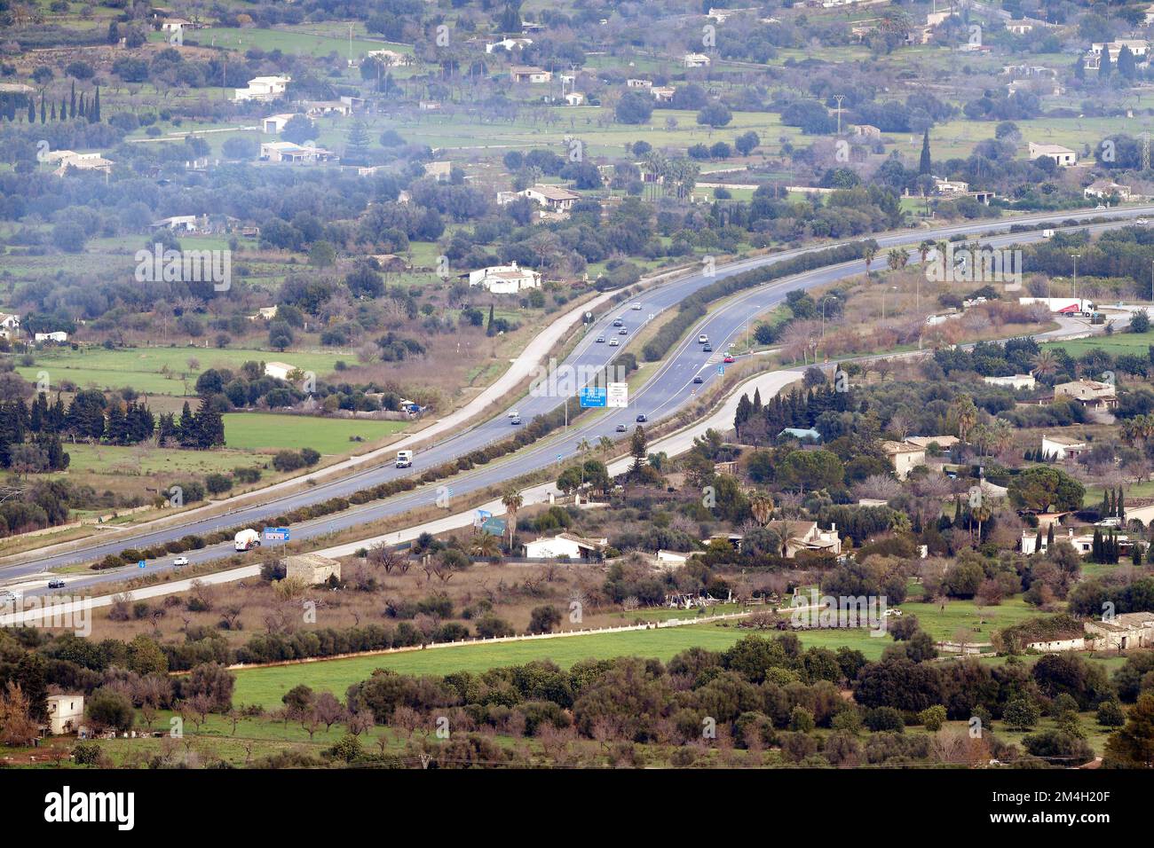 Aerial view of the Palma-Alcudia highway (Ma-13), passing through Inca ...