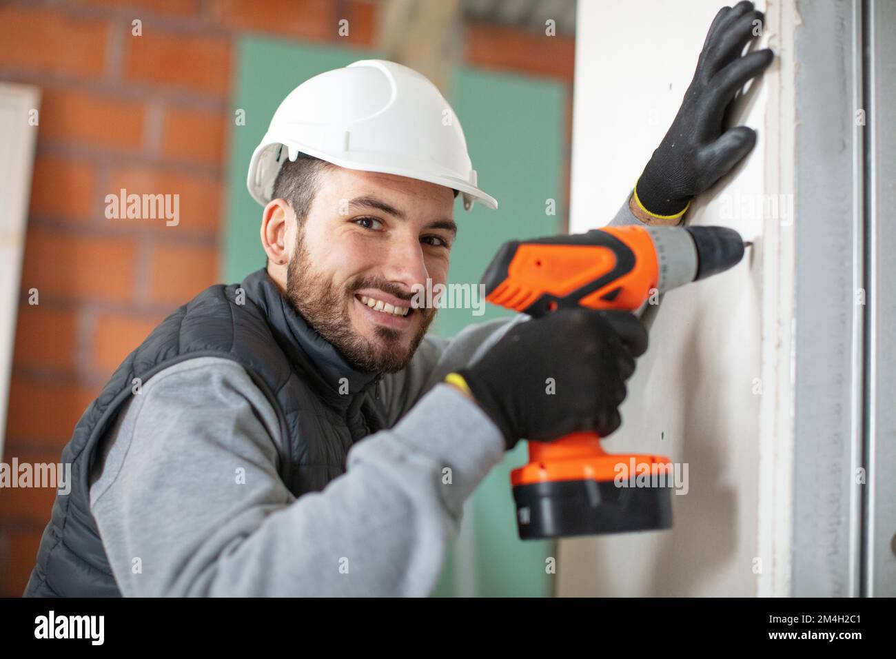 worker with demolition hammer breaking interior wall Stock Photo - Alamy