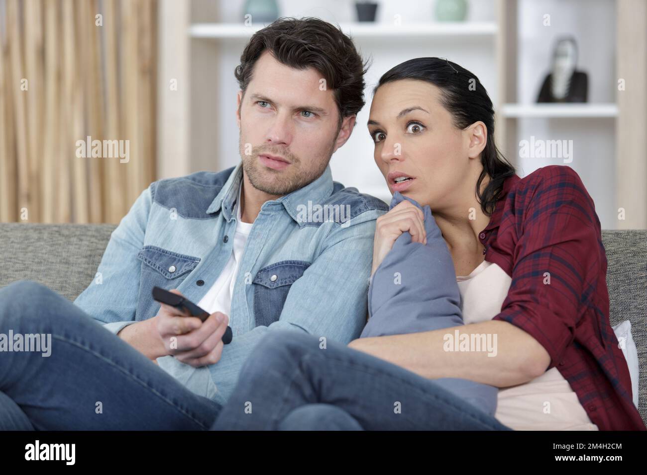 Couple scared hugging hi-res stock photography and images - Alamy