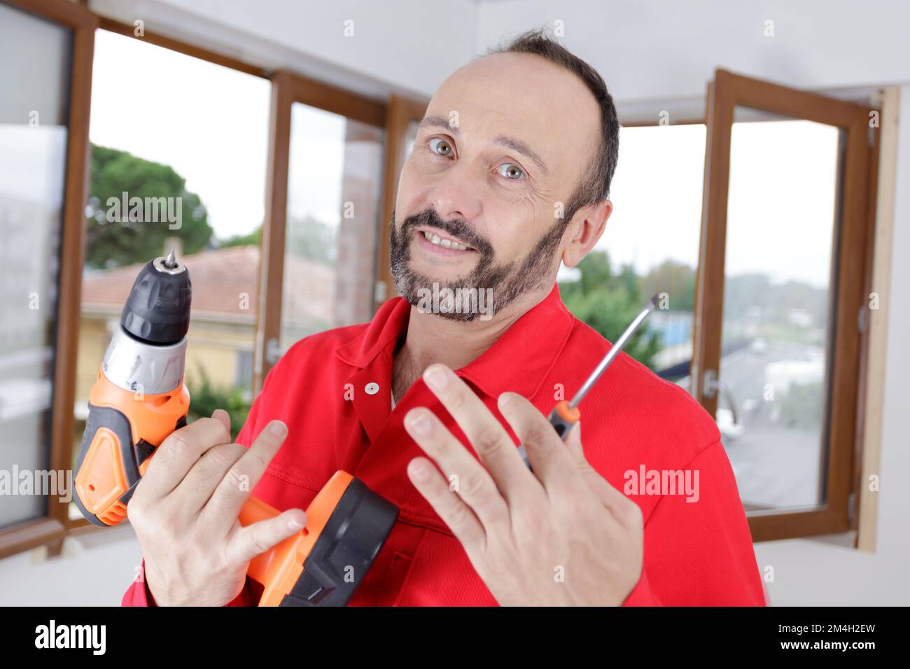 Two men drilling hole hi-res stock photography and images - Alamy
