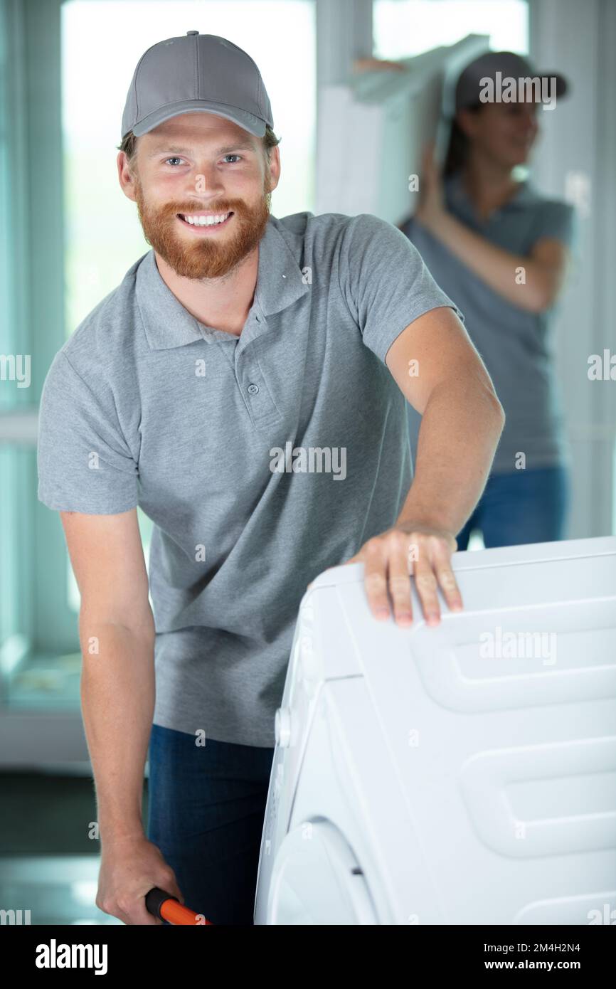 Carrying washing machine hi-res stock photography and images - Alamy