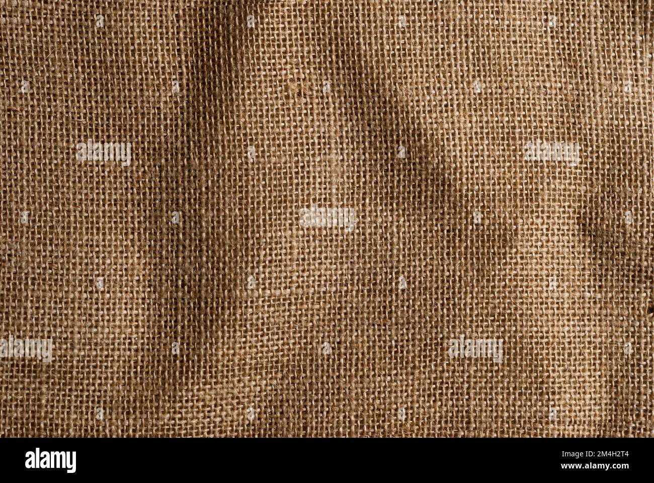 background of handmade fabric sewn with old hemp threads horizontally ...