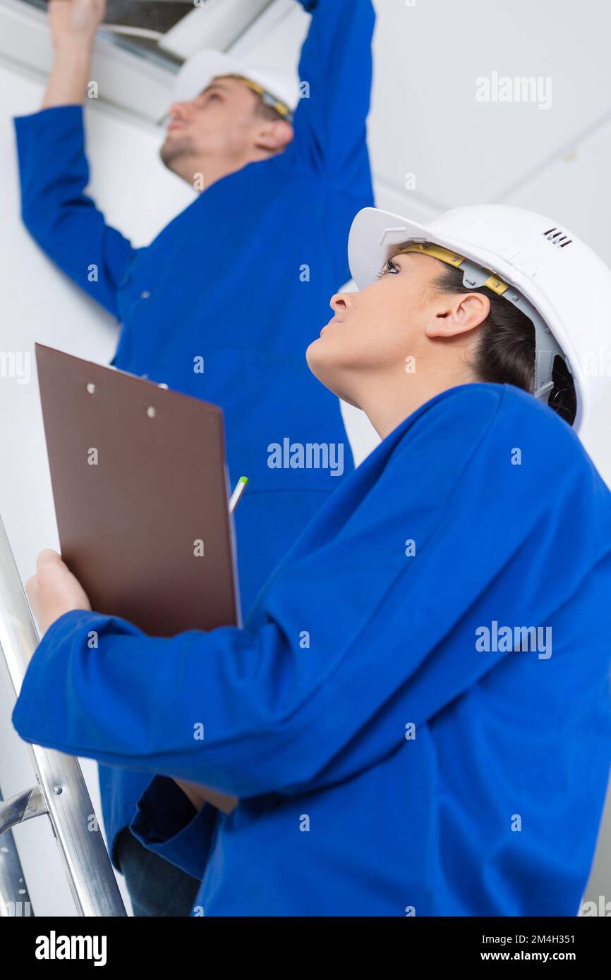two technical engineers checking electrical equipment Stock Photo - Alamy
