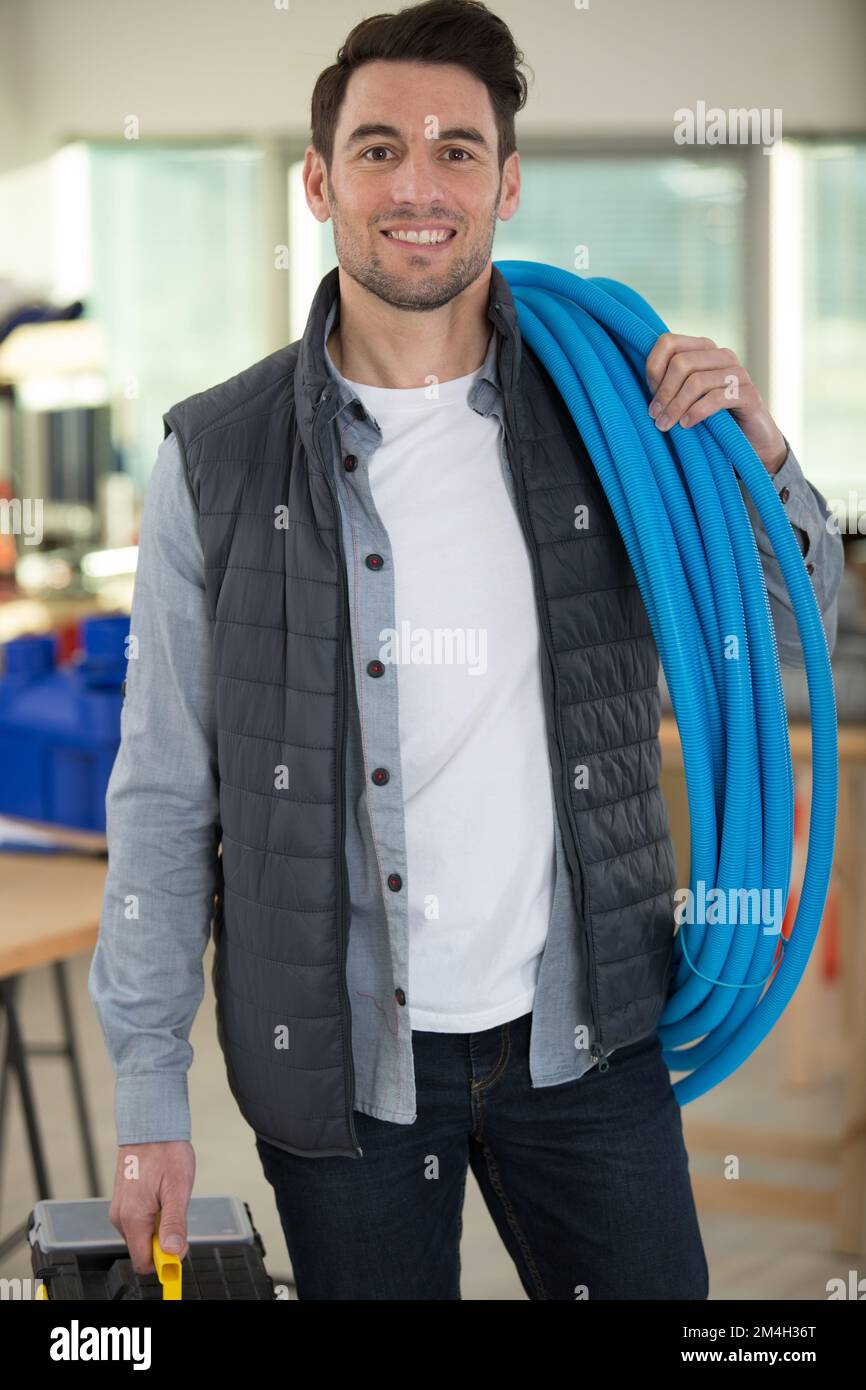 man is ready to lay electric cables Stock Photo - Alamy