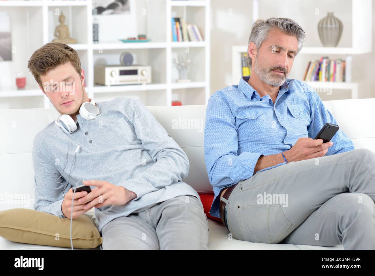 Using two cellphones hi-res stock photography and images - Alamy