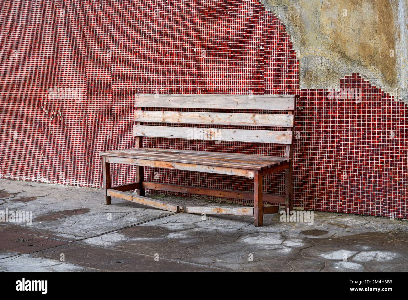 An old wooden bench in an old neighborhood outdoors Stock Photo - Alamy