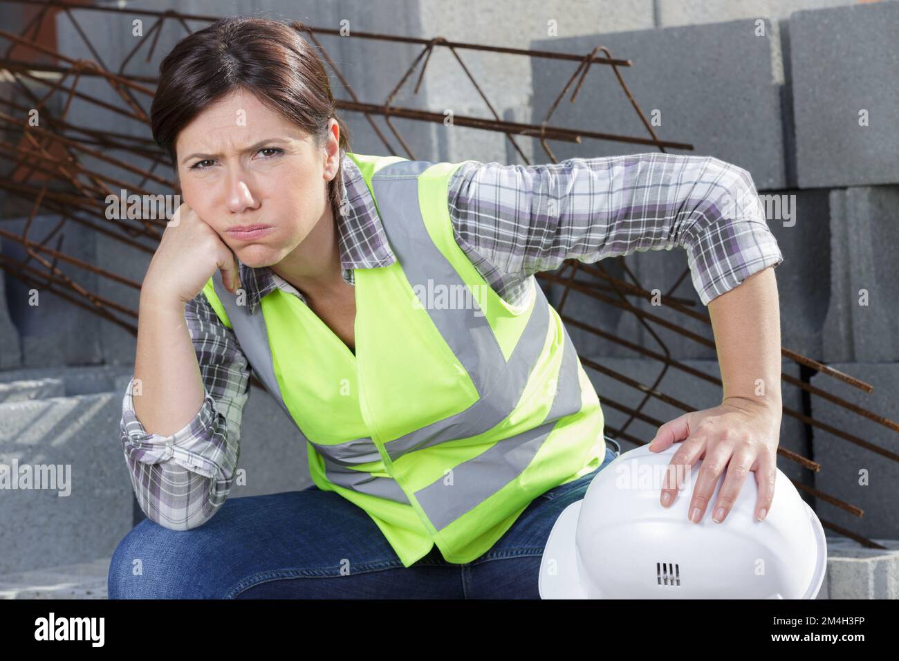 upset woman engineer looking at the camera Stock Photo - Alamy