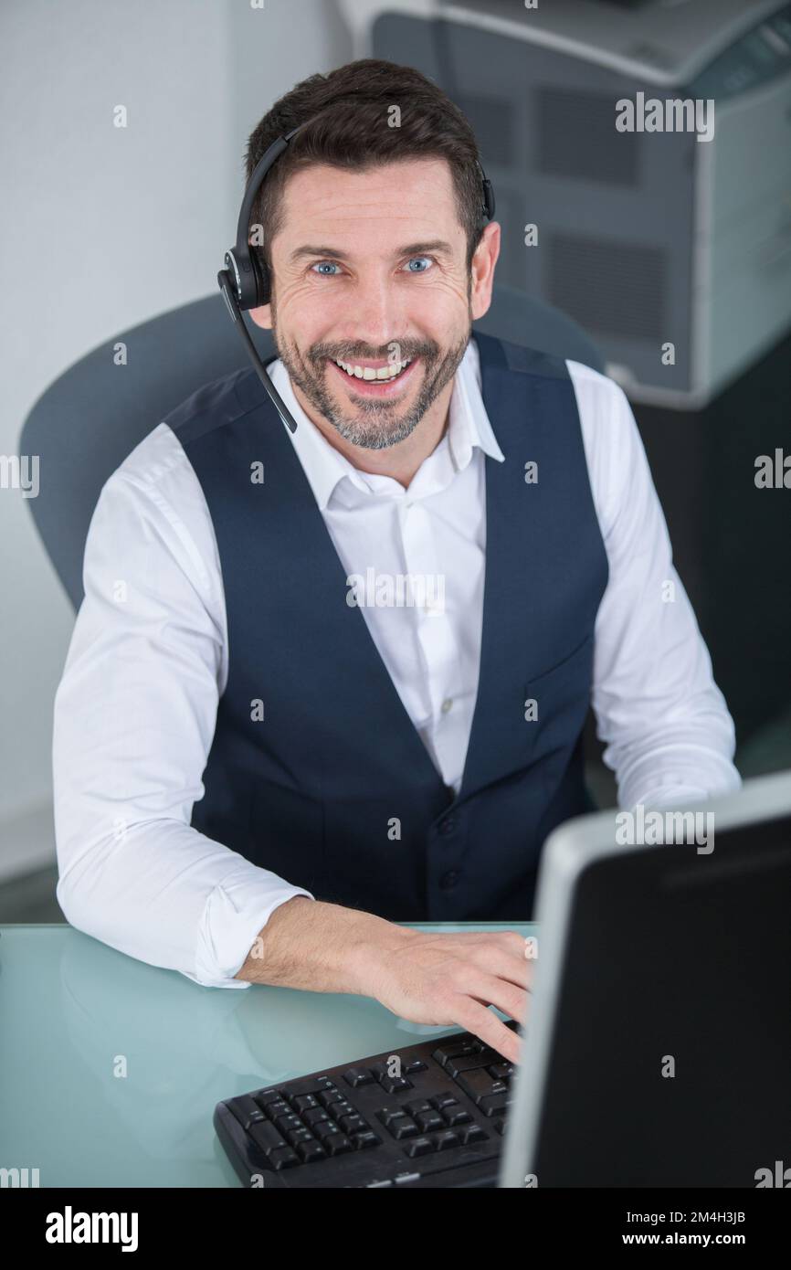 middle aged customer service representative Stock Photo - Alamy