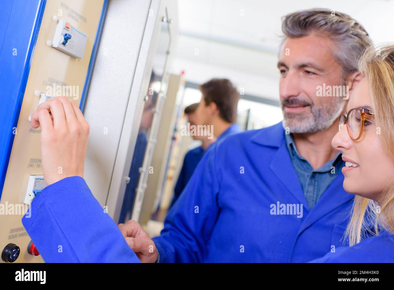 student and teacher with switch Stock Photo - Alamy