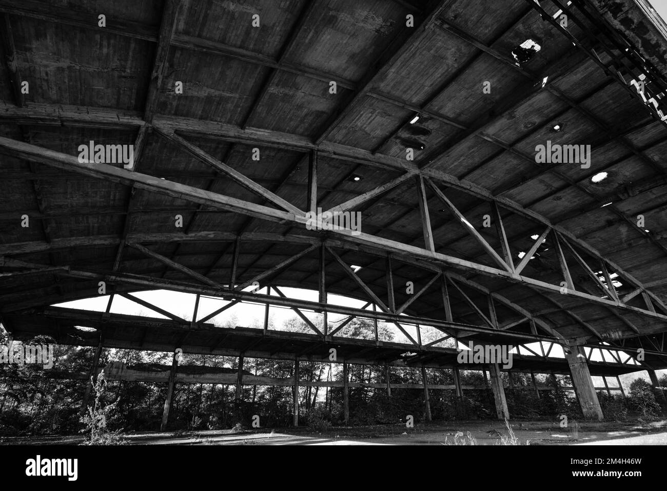 Old arched metal structures abandoned air hangar Stock Photo - Alamy