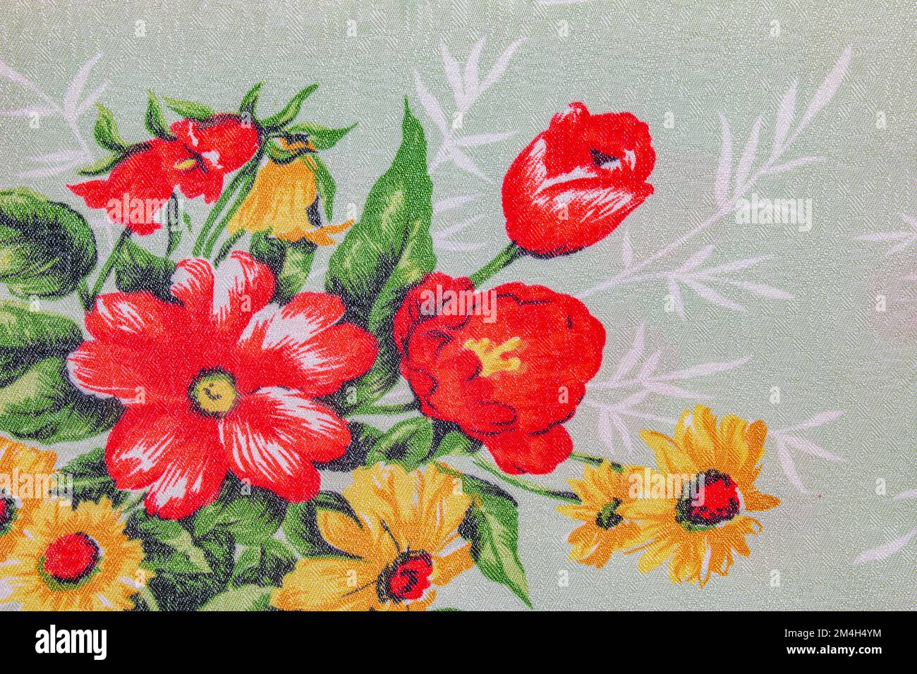 Composition of bright flowers on a coarse linen cotton fabric ...