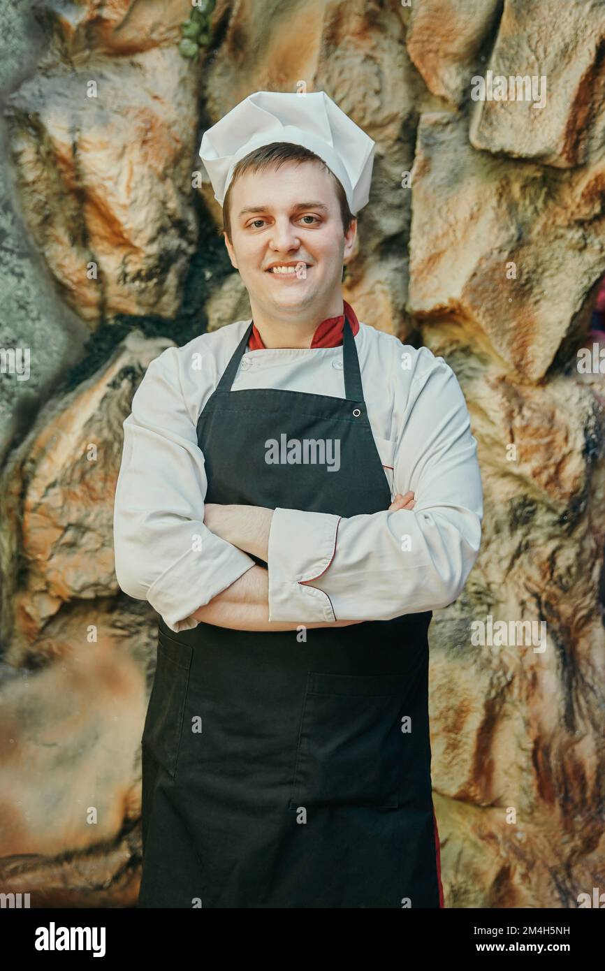 successful chef posing near the entrance to the hall cafe Stock Photo ...