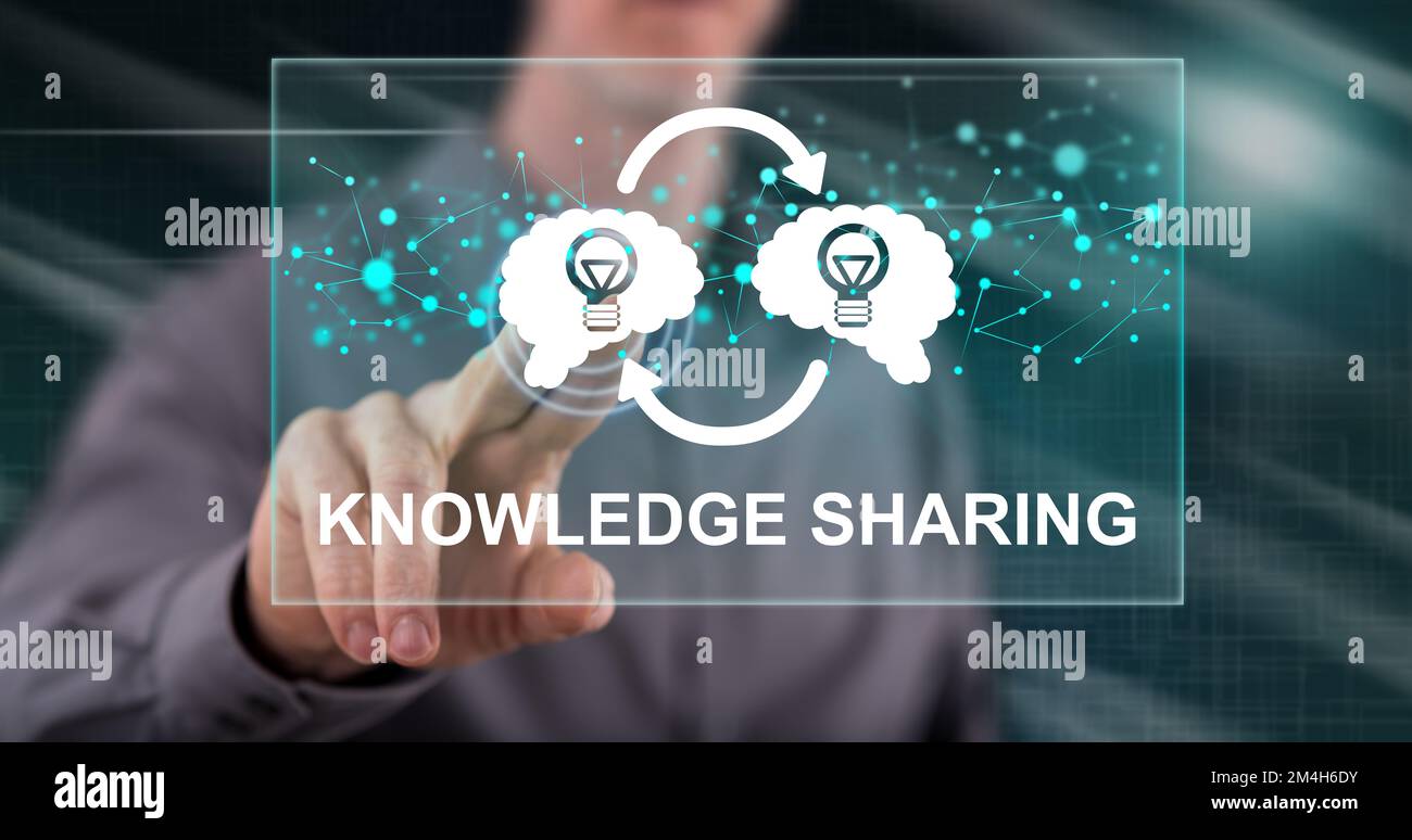 Man touching a knowledge sharing concept on a touch screen with his ...