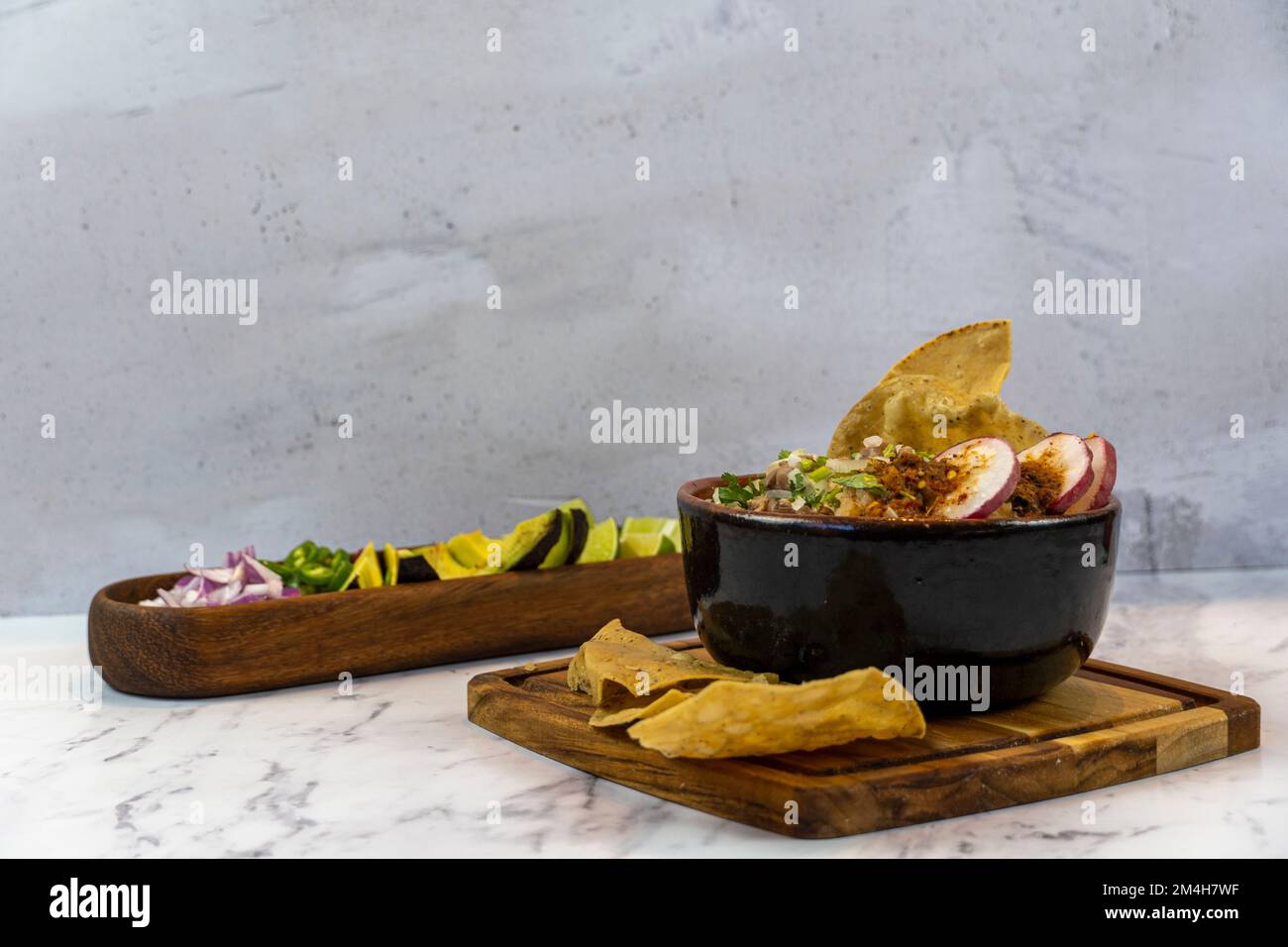 includes tatemada hot sauce, bacon, onion and cilantro on top ...