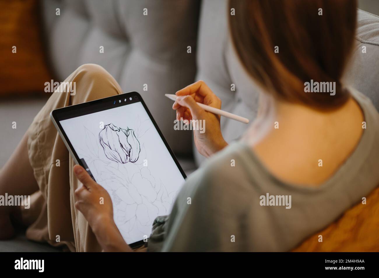 Artist or designer making new project, drawing on a graphic tablet with ...