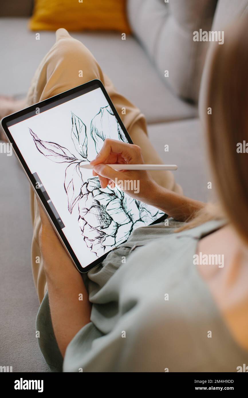 Artist or designer making new project, drawing on a graphic tablet with ...