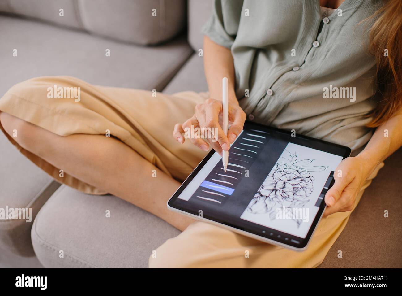 Artist or designer making new project, drawing on a graphic tablet with ...