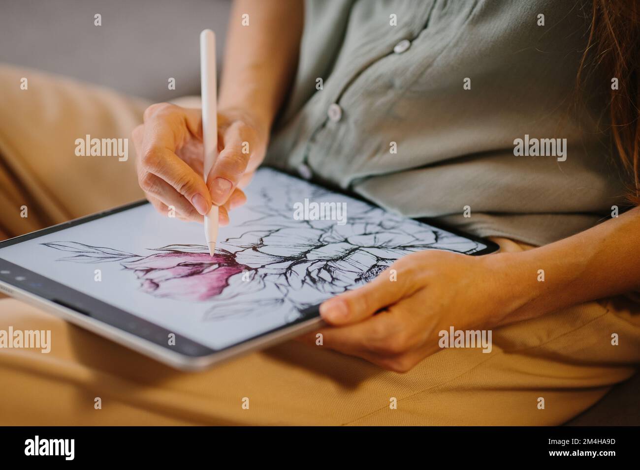 Artist or designer making new project, drawing on a graphic tablet with ...