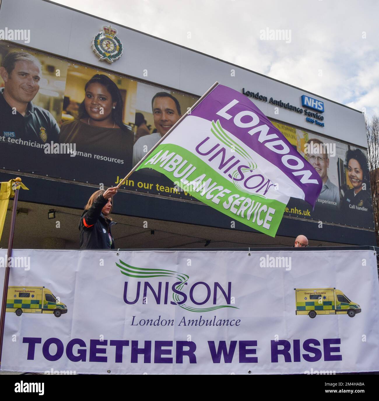 London, England, UK. 21st Dec, 2022. A Unison member waves a Unison ...