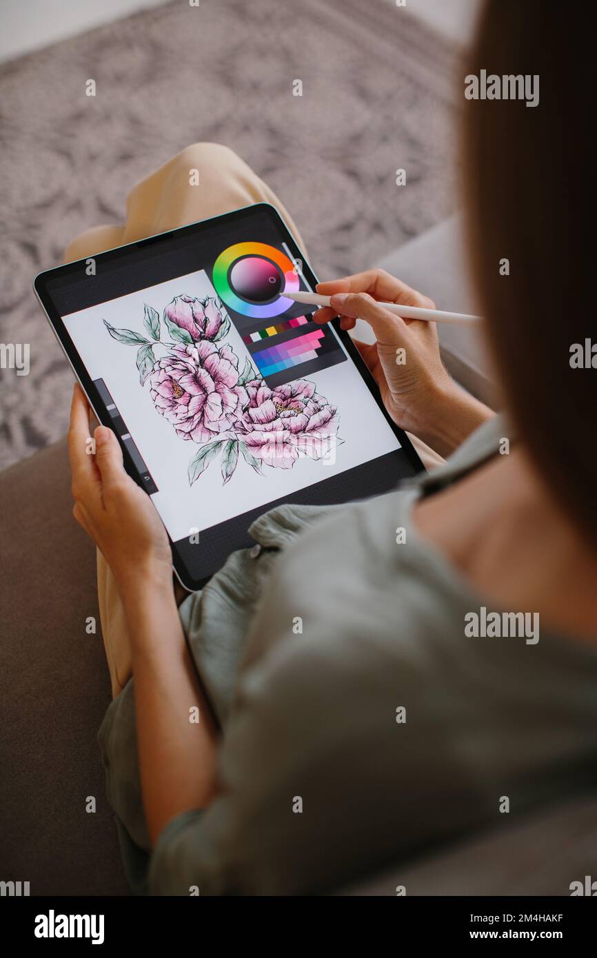 Artist or designer making new project, drawing on a graphic tablet with ...