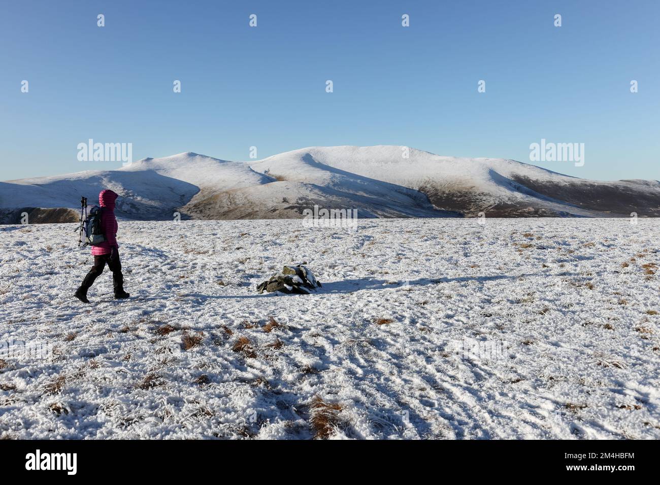 Walker Approaching the Summit Cairn of Mungrisdale Common in Winter ...