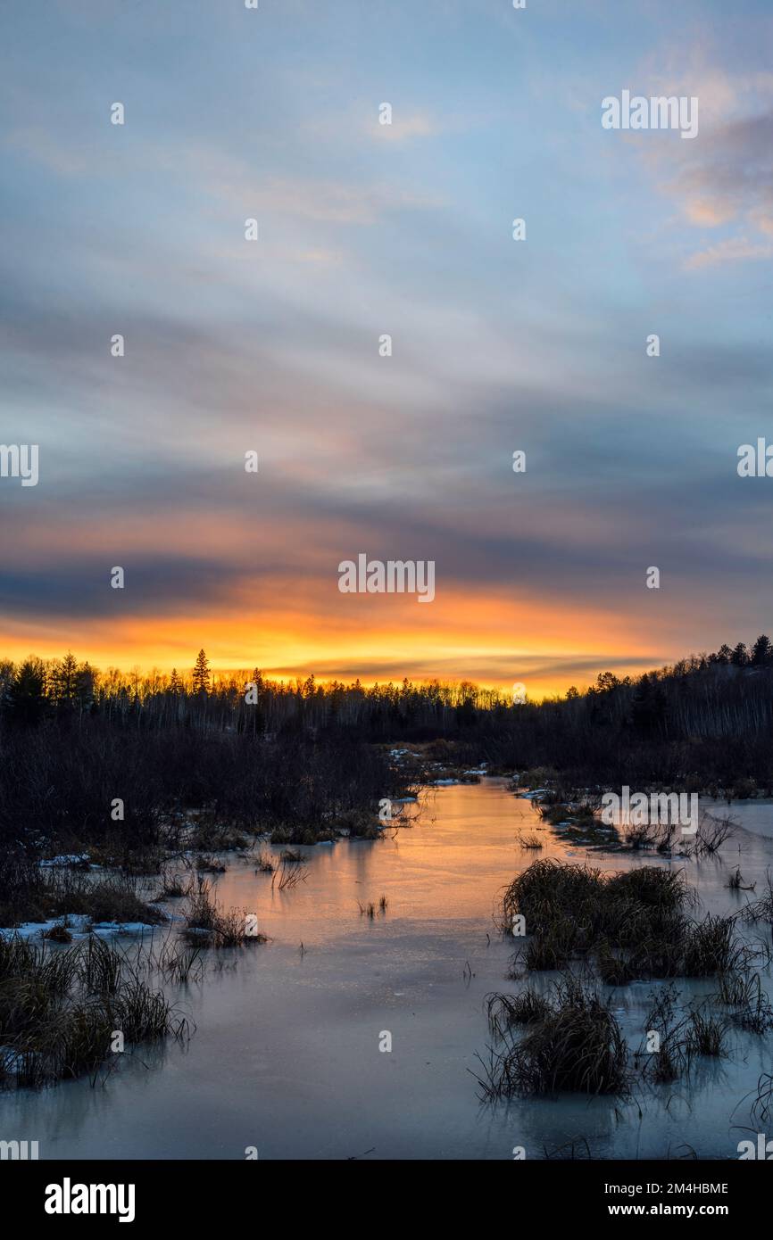 Sunset skies, beaver pond at freeze-up, Greater Sudbury, Ontario ...