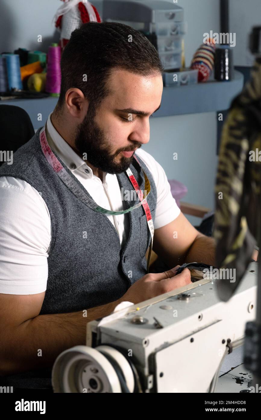 Man sewing hi-res stock photography and images - Alamy