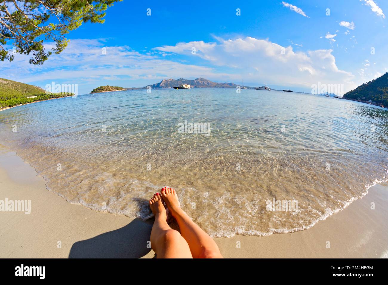 Woman lying on beach legs hi-res stock photography and images - Alamy