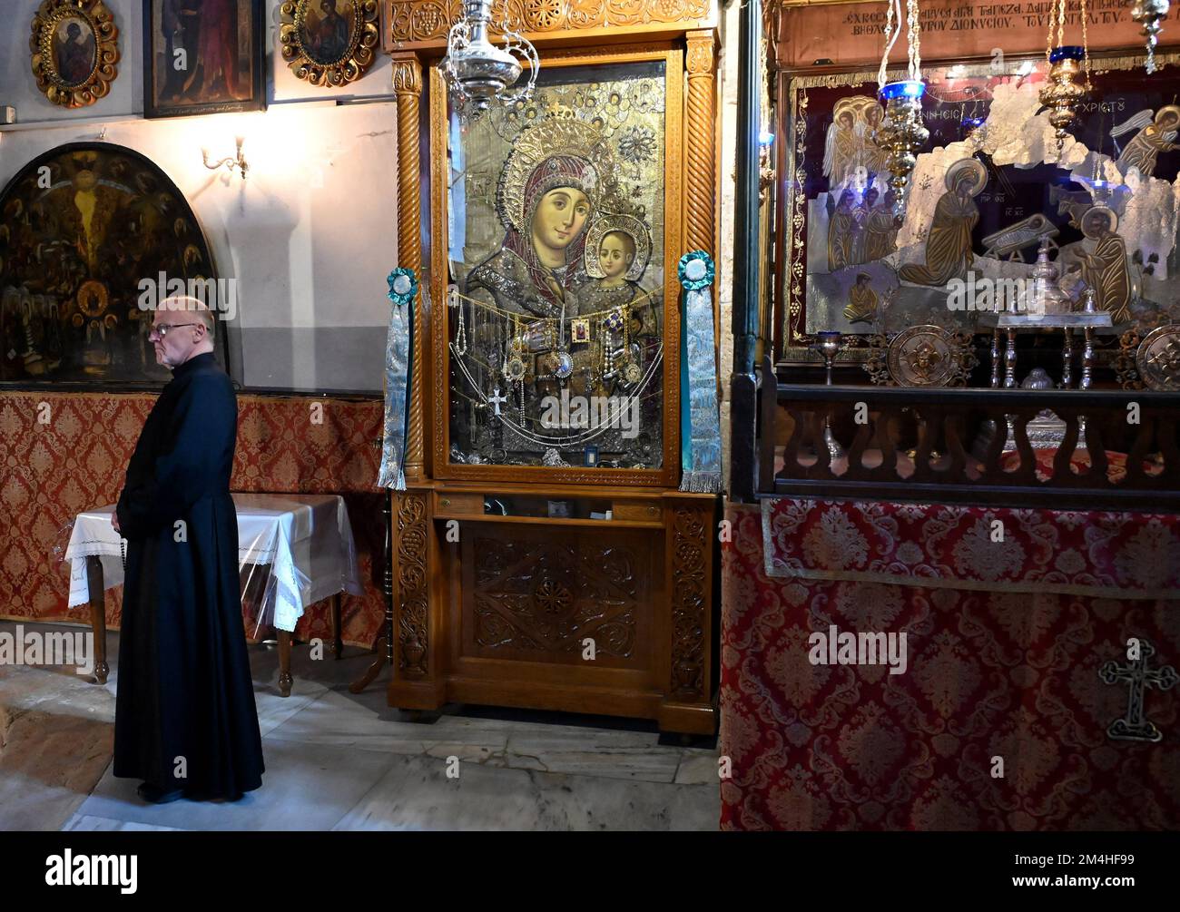 Bethlehem, West Bank. 21st Dec, 2022. A priest stands in the Church of ...