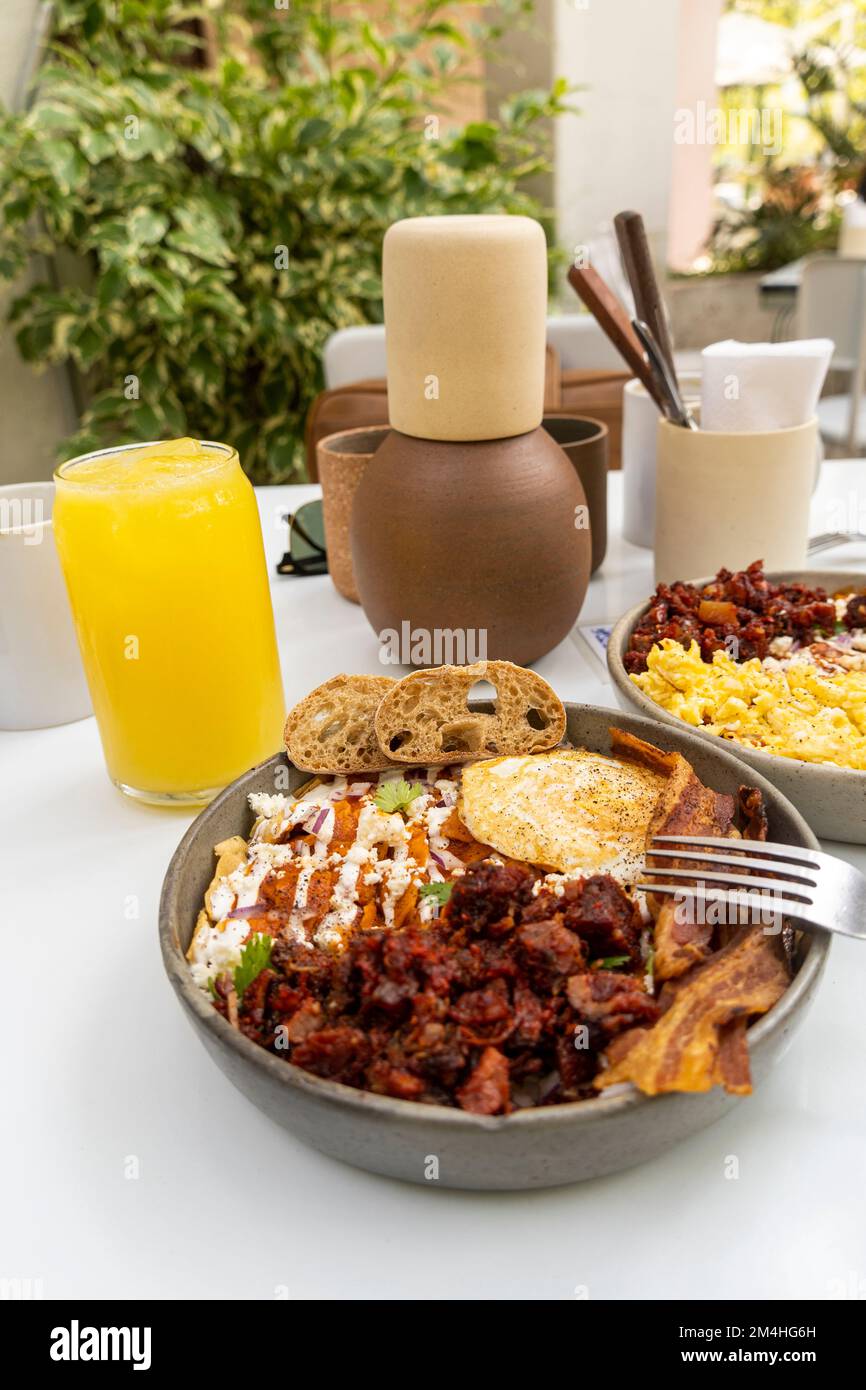 traditional full breakfast in mexico, with sauces, juices, pans as hot ...