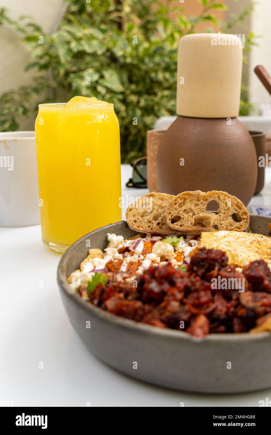 traditional full breakfast in mexico, with sauces, juices, pans as hot ...