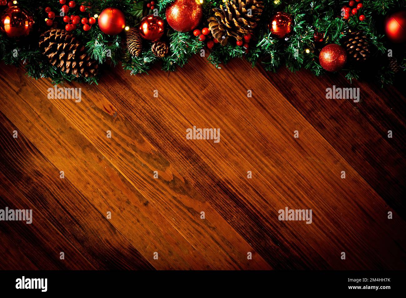 Christmas decorations and fir branches on wooden board background with ...