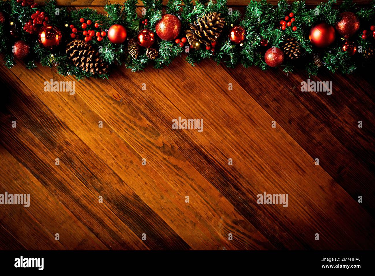 Christmas decorations and fir branches on wooden board background with ...