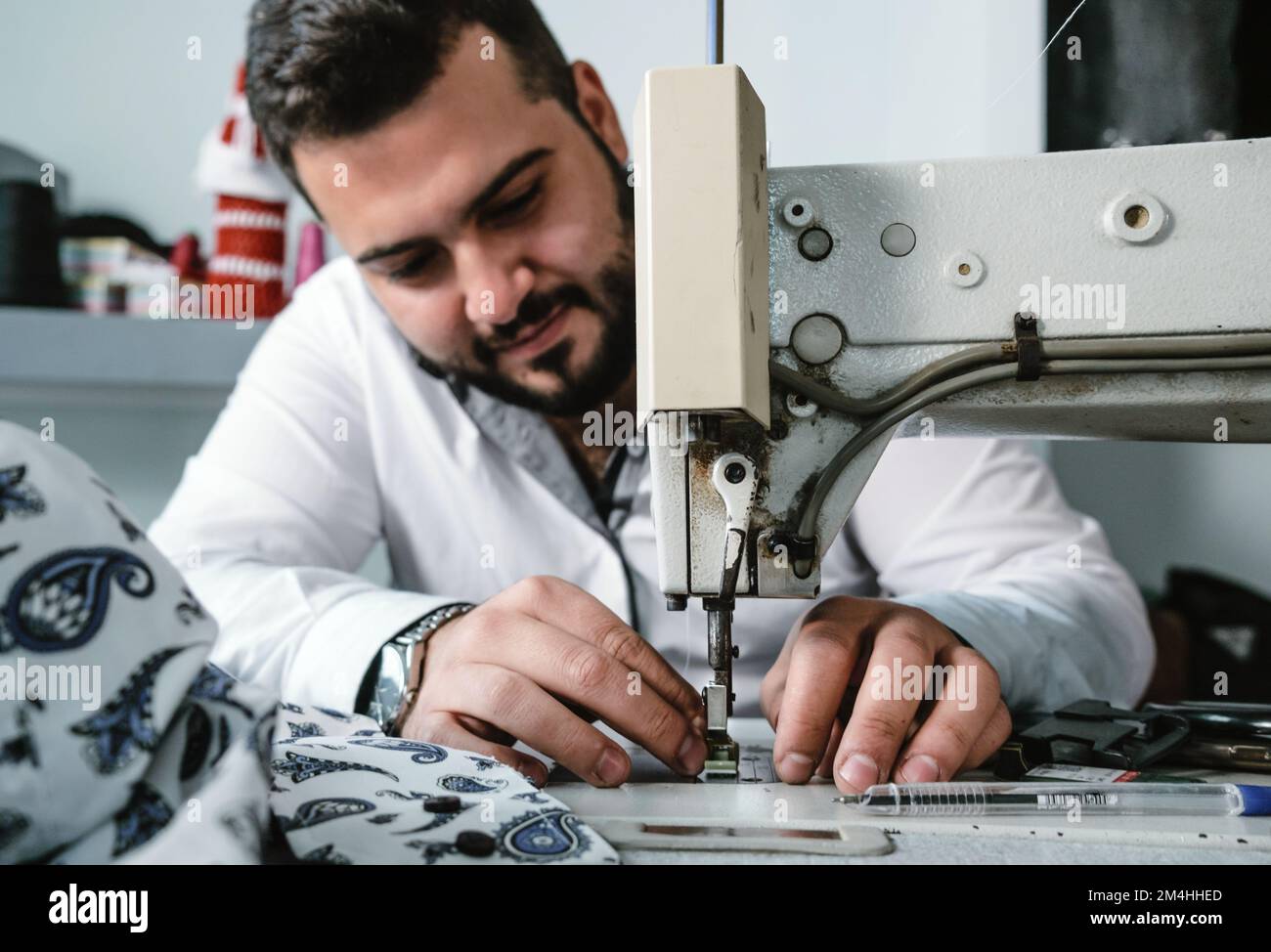 Tailor Man sewing Stock Photo - Alamy