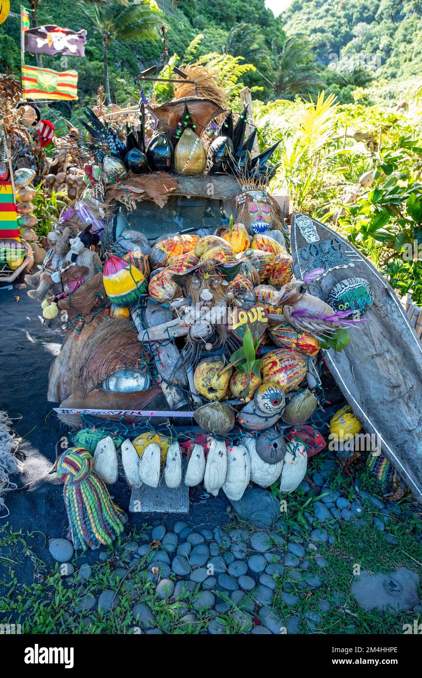 Roadside art made from recycled coconuts and clothing on the road to ...