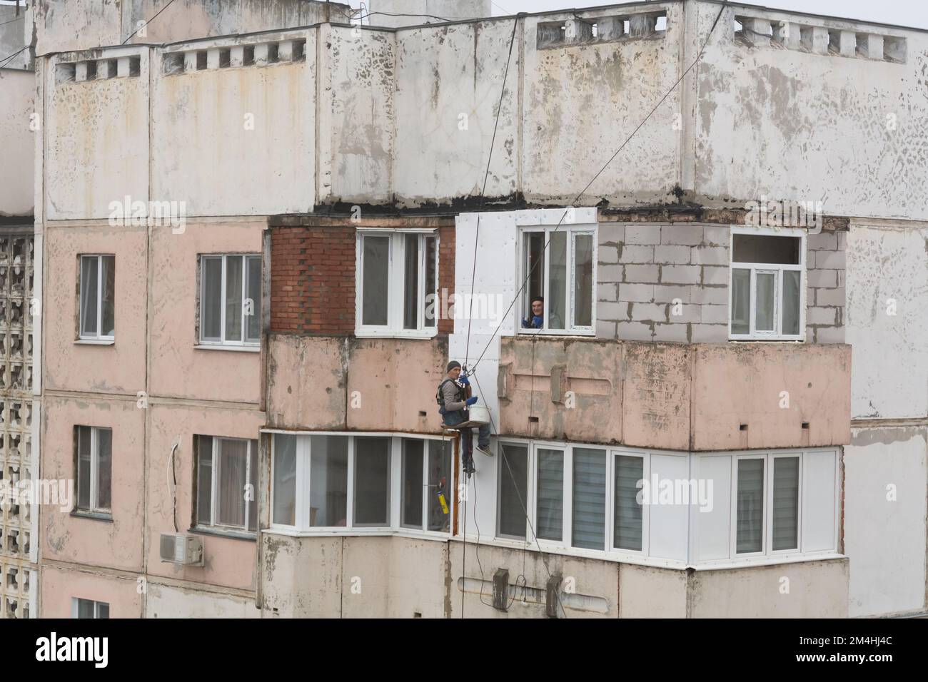 Tiraspol, Moldova - December 10, 2022: High altitude builder insulates ...