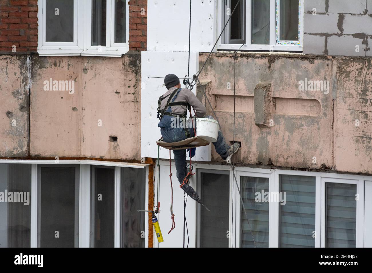 Tiraspol, Moldova - December 10, 2022: High altitude builder insulates ...
