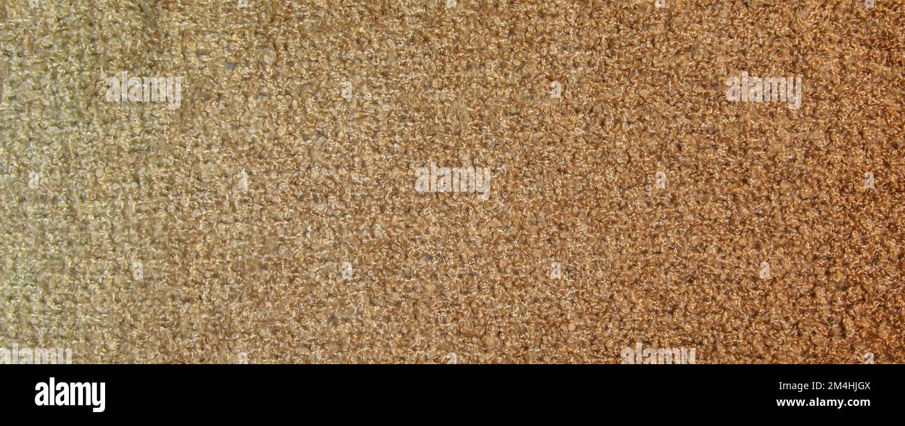 Knitted wool textile textured background in light beige creamy brown ...